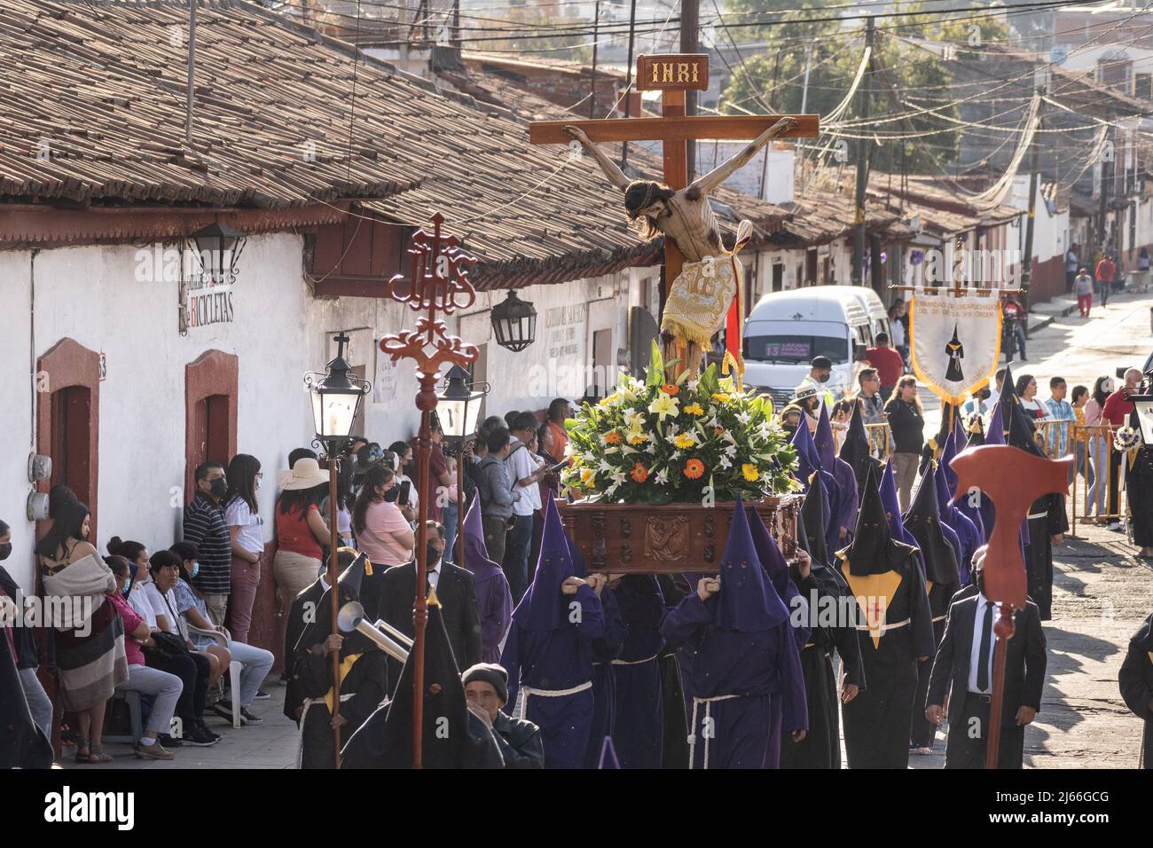 Roman Catholic hooded penitents wearing traditional capirotes, carry a ...