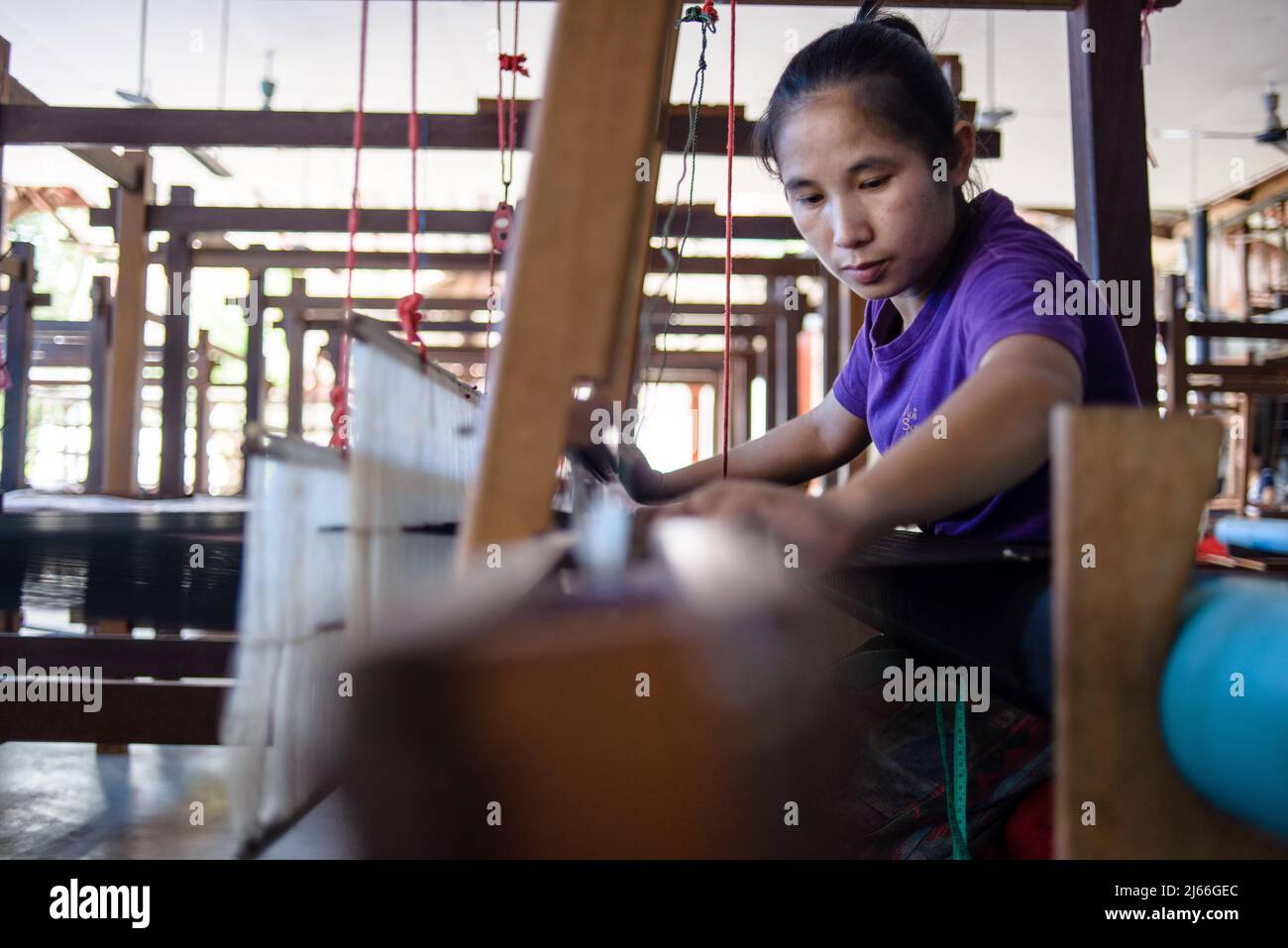 Silk weaving process at the Mai Savanh Lao workshop in Vientiane, Laos ...