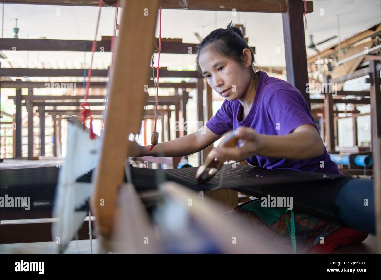 Silk weaving process at the Mai Savanh Lao workshop in Vientiane, Laos ...