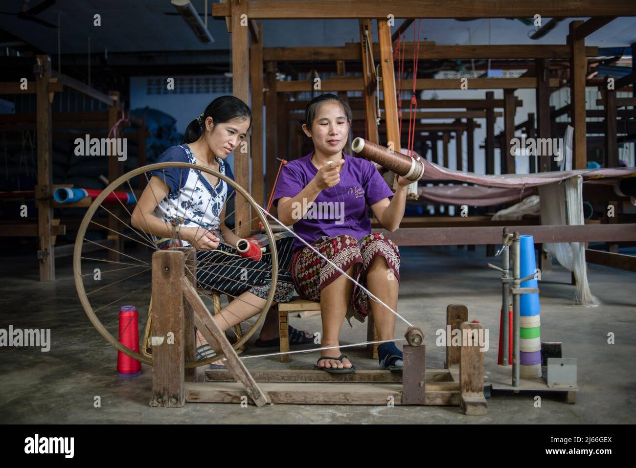 Silk weaving process at the Mai Savanh Lao workshop in Vientiane, Laos ...