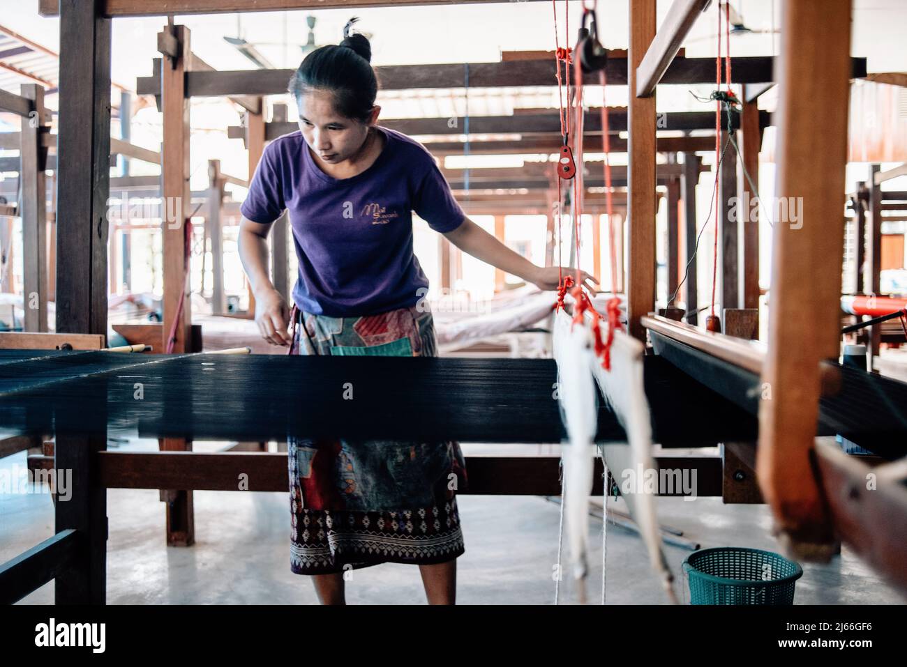 Silk weaving process at the Mai Savanh Lao workshop in Vientiane, Laos ...