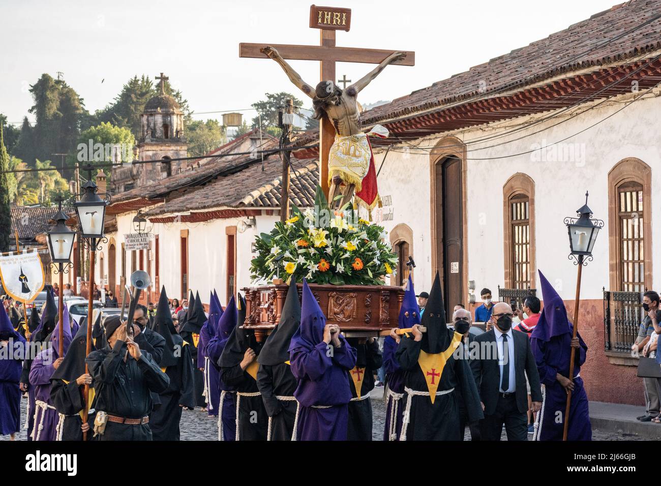 Roman Catholic hooded penitents wearing traditional capirotes, carry a ...