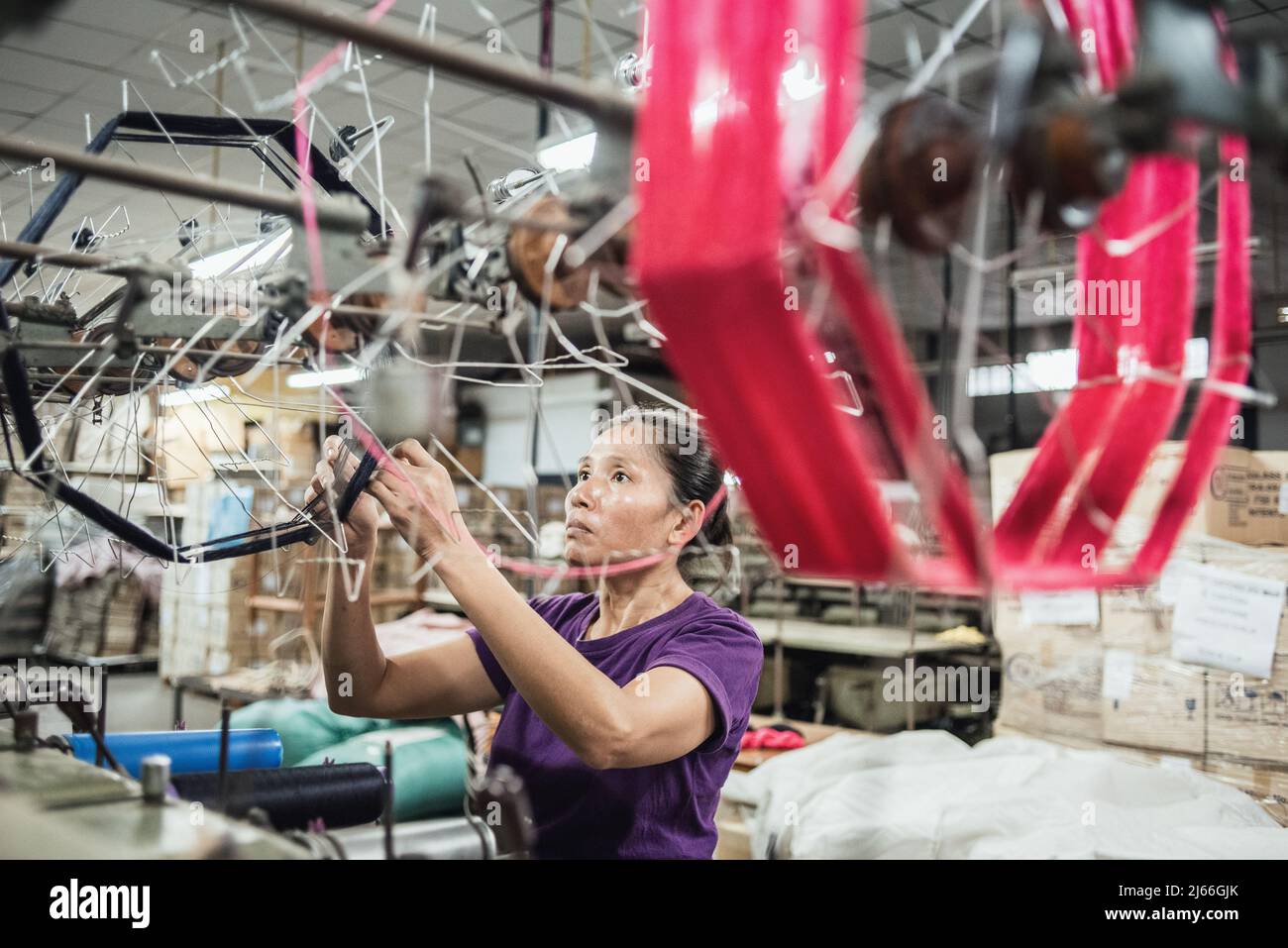 Silk weaving process at the Mai Savanh Lao workshop in Vientiane, Laos ...
