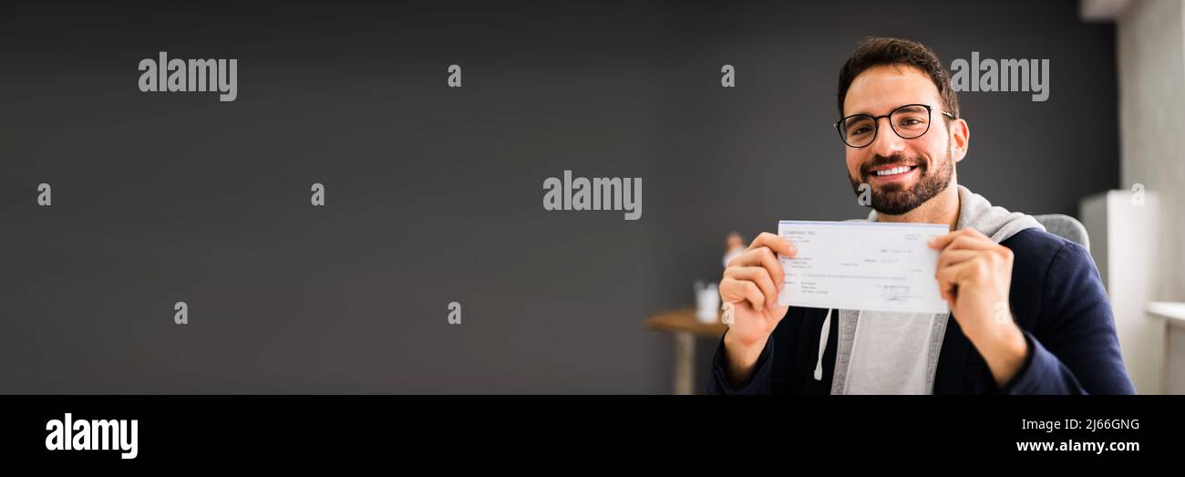 Man holding cheque hi-res stock photography and images - Alamy