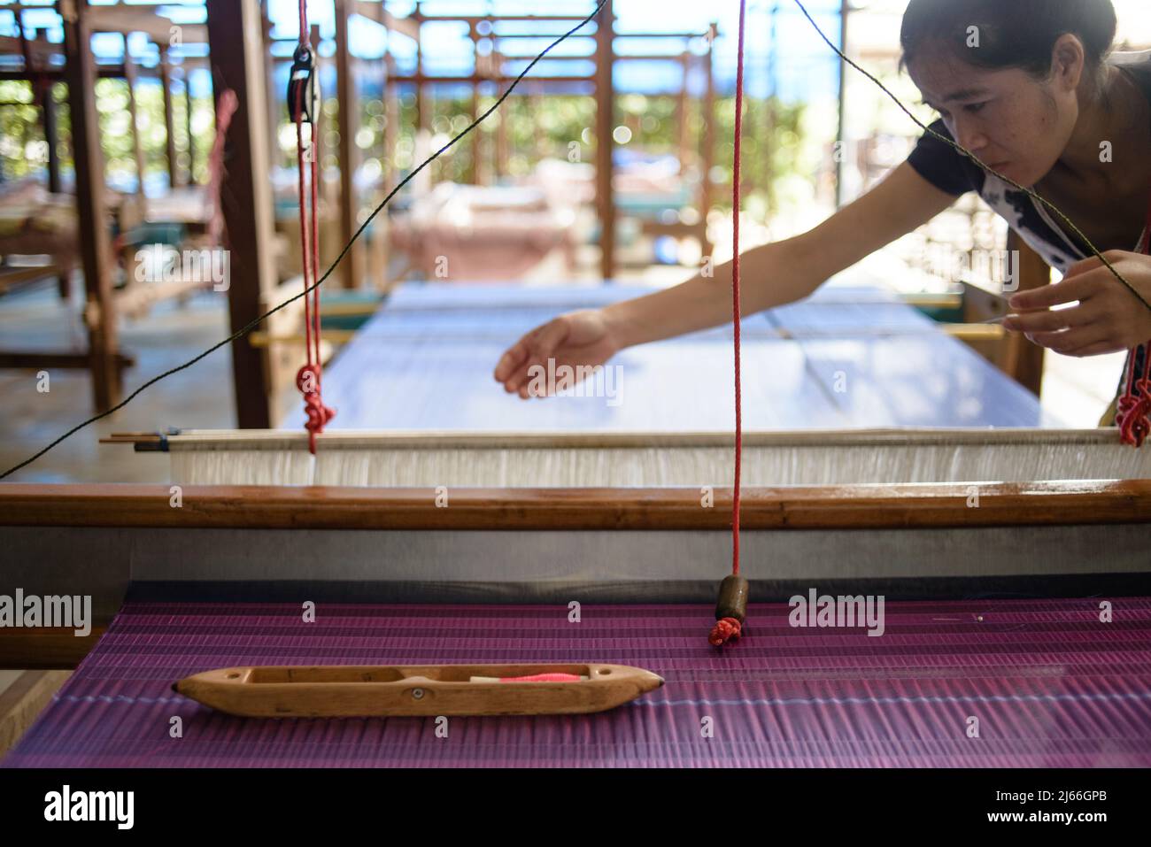 Silk weaving process at the Mai Savanh Lao workshop in Vientiane, Laos ...