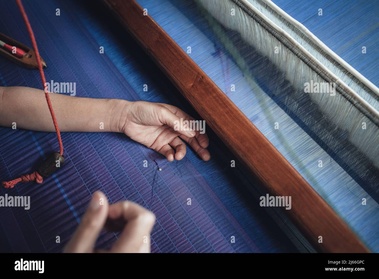 Silk weaving process at the Mai Savanh Lao workshop in Vientiane, Laos ...