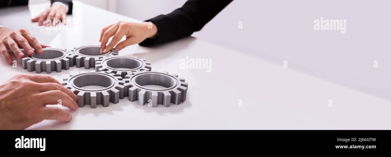 Group business people meeting gears hi-res stock photography and images ...