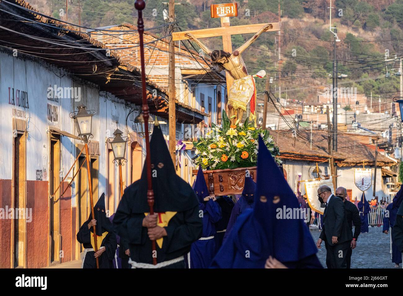 Roman Catholic hooded penitents wearing traditional capirotes, carry a ...