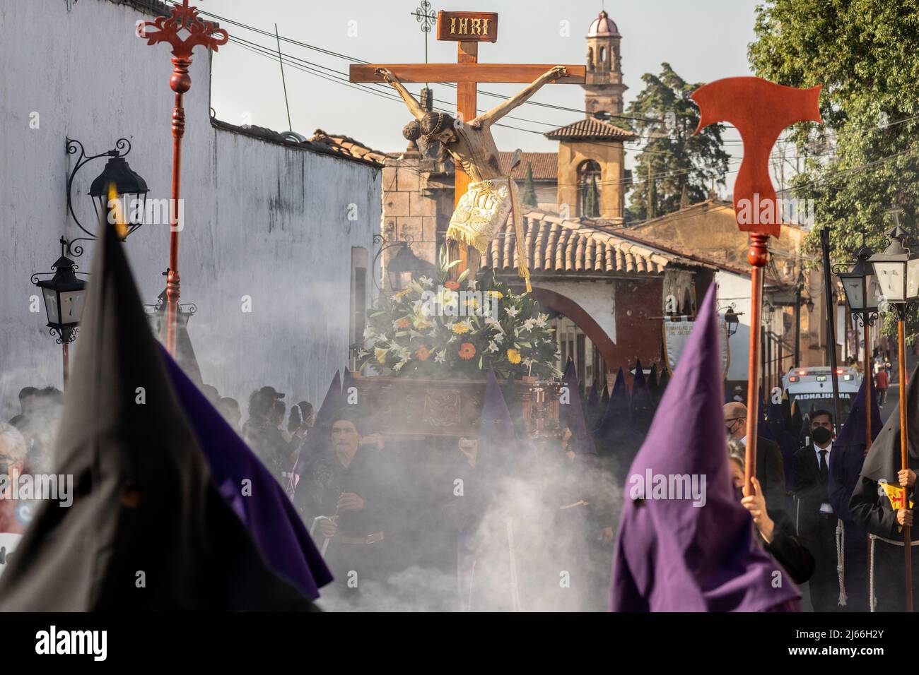 Roman Catholic hooded penitents wearing traditional capirotes, carry a ...