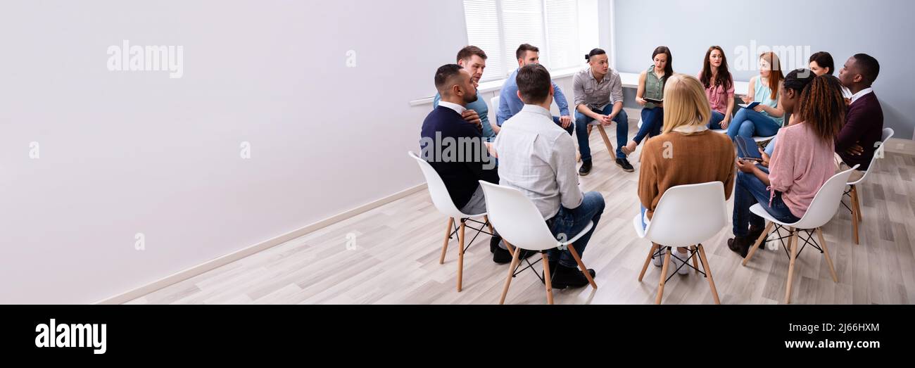 Young Multiracial Millennial Friends Sitting In Circle Having Group ...