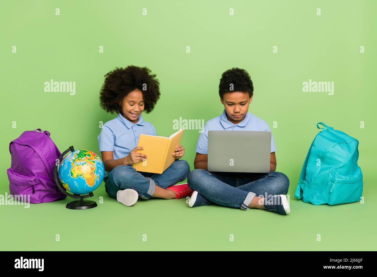 Portrait of attractive pre-teen friends friendship doing homework ...