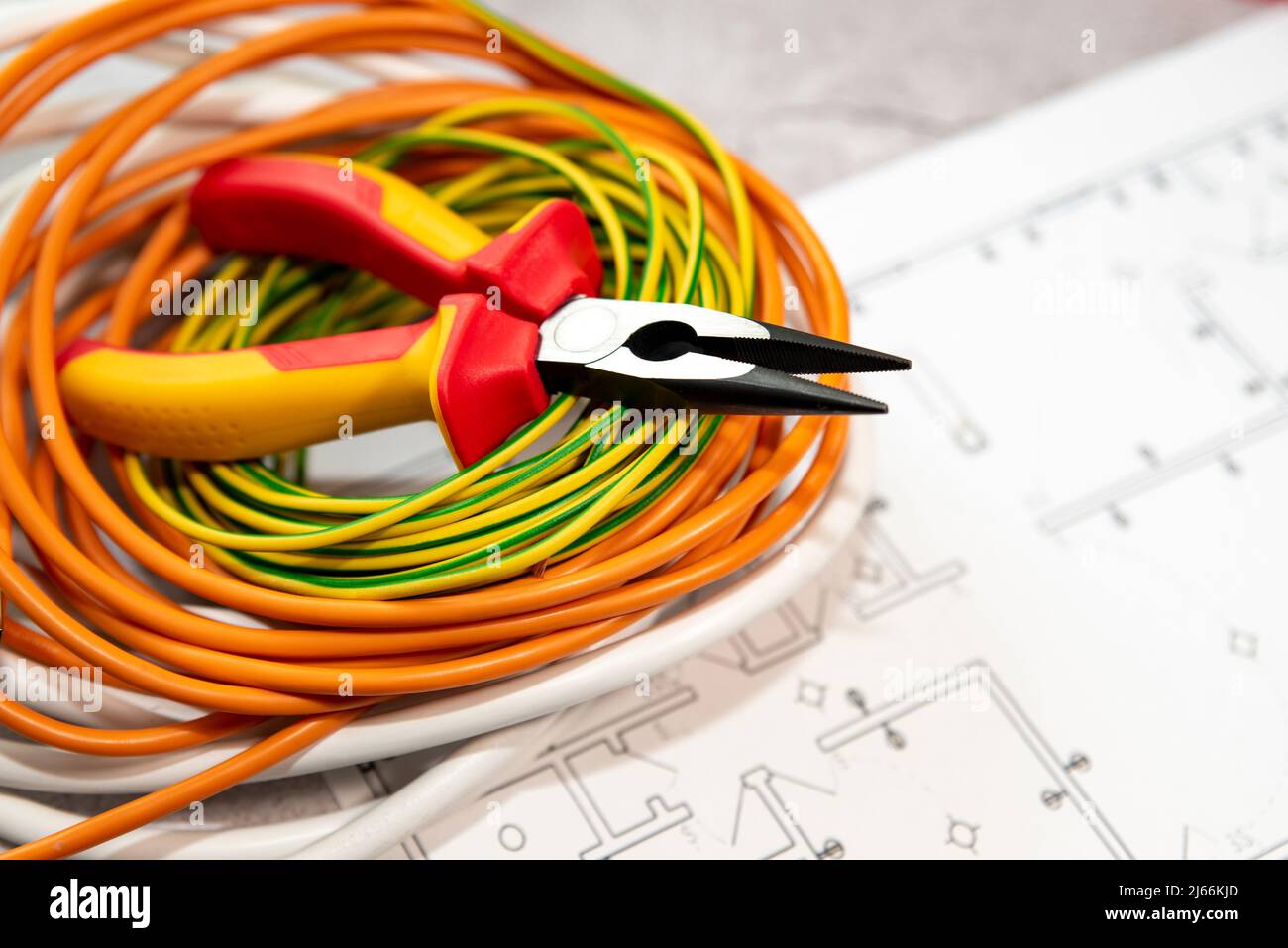 Electrician's tool and cable hank on the house electrification plan ...