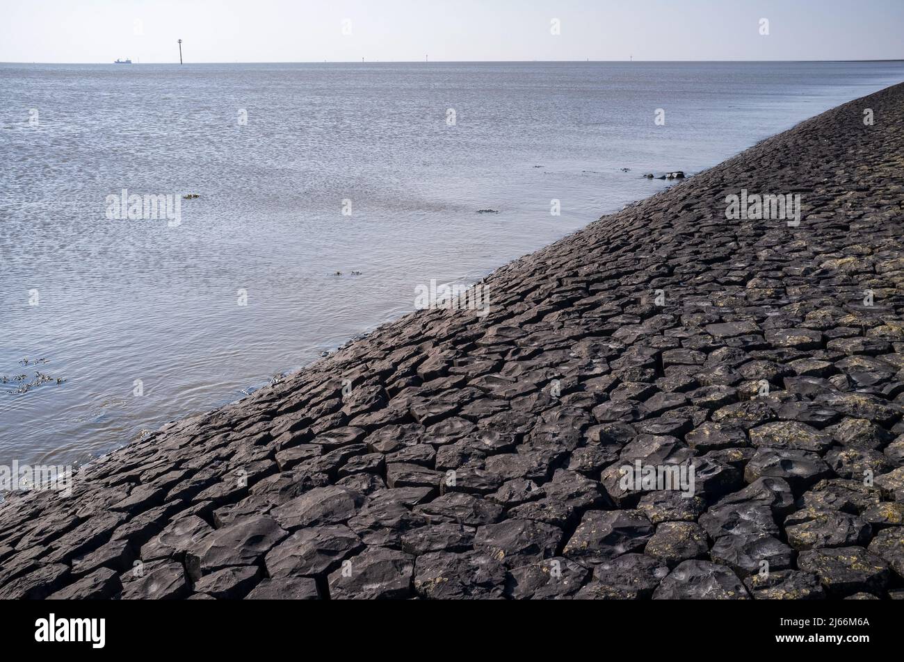 Cobblestone embankment. The seashore, fortified with stones from ...