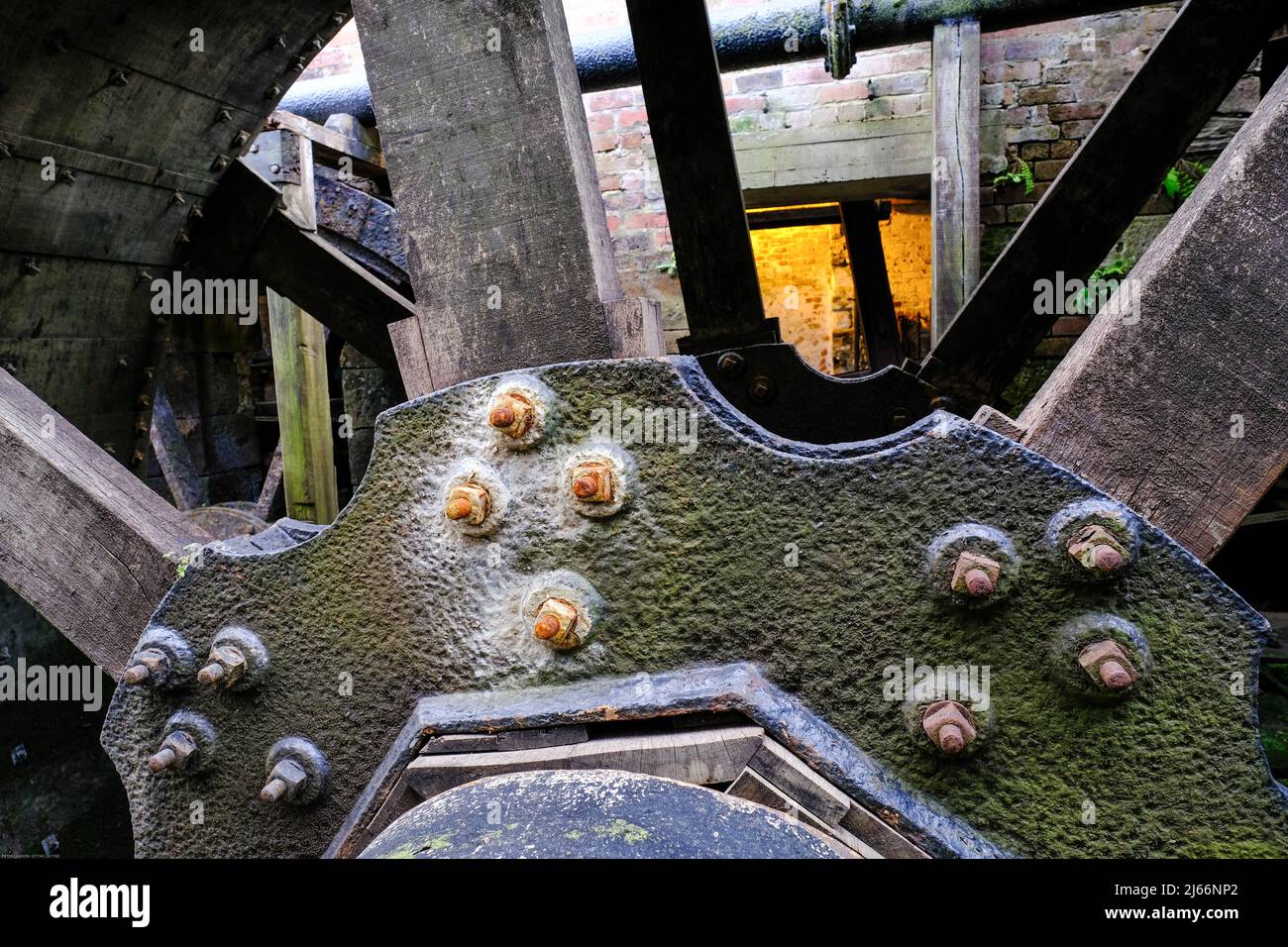 Giant rusted cog wheels rest beside an old water wheel in Abbeydale ...