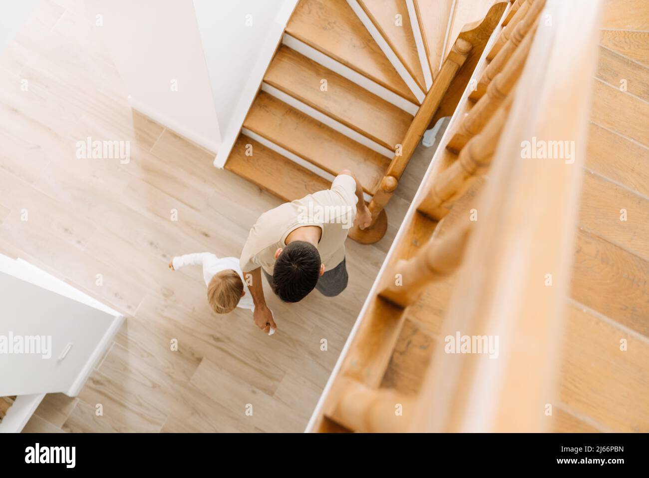 Man coming down stairs hi-res stock photography and images - Alamy