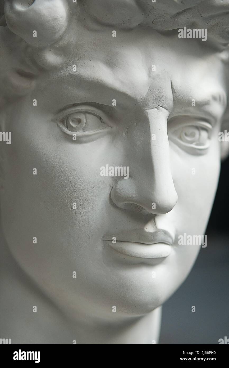 An Old Plaster Sculpture Of A Man On The Table. Portrait, the face of a ...