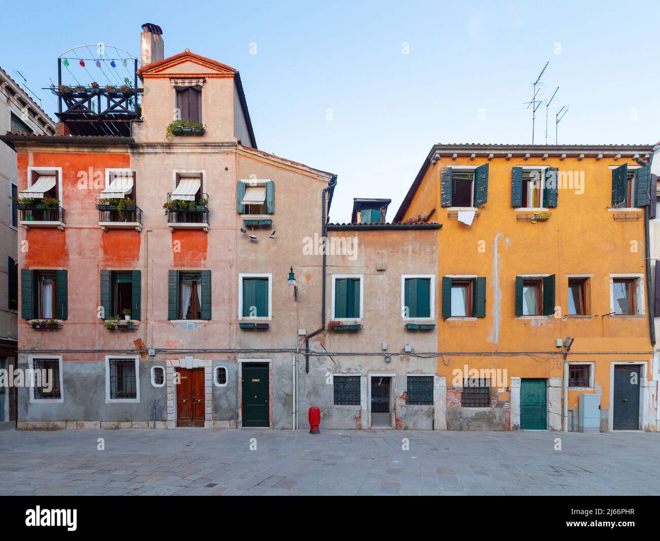 Old multi-storey traditional Venetian houses in the town square. Venice ...