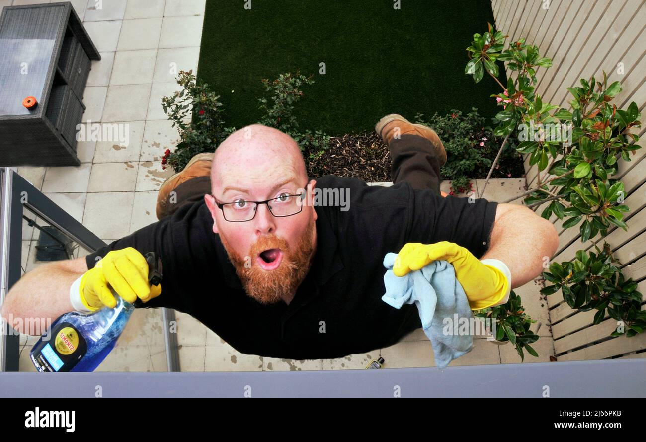 man falling out of window Stock Photo - Alamy