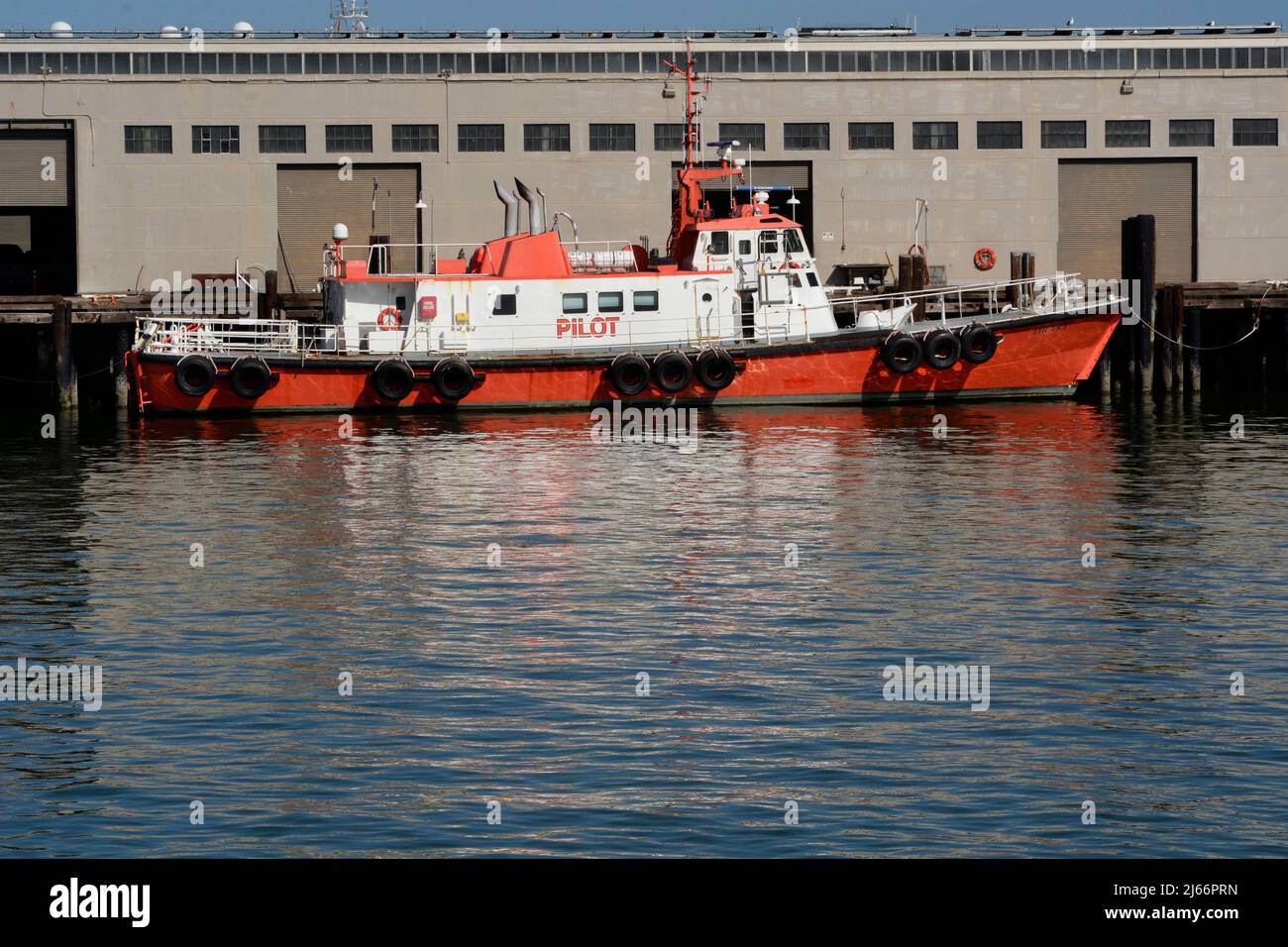 A Bar Pilot vessel docked along the eastern waterfront of San Francisco ...
