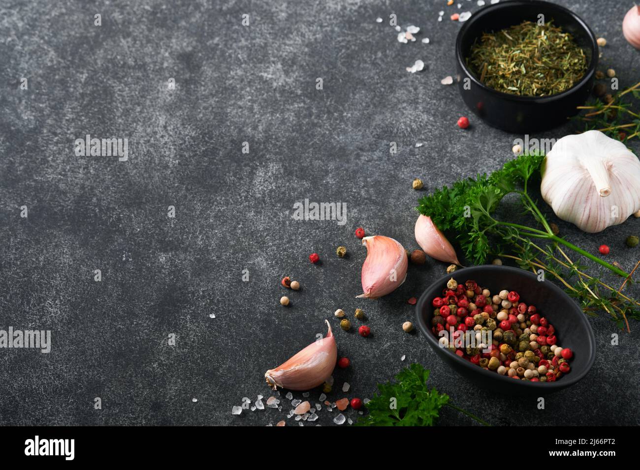 Black food cooking background. Stone texture with sea salt, pepper ...