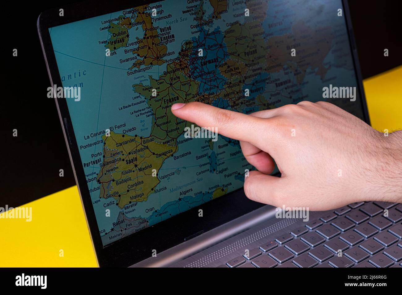 Pointing France on map on laptop screen, man hand showing France by ...