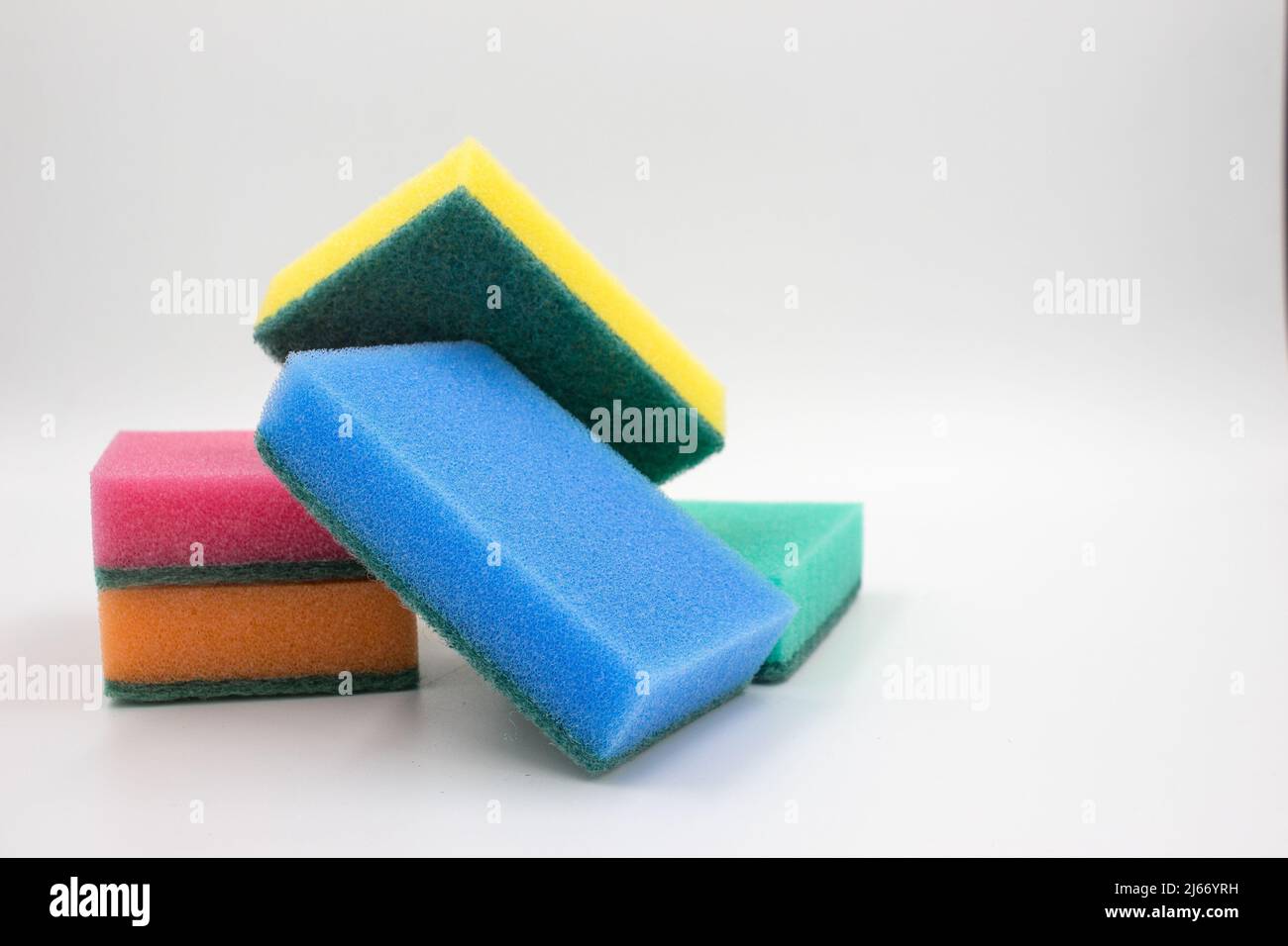 Multi-colored sponges for household work from foam rubber, stack, on a ...