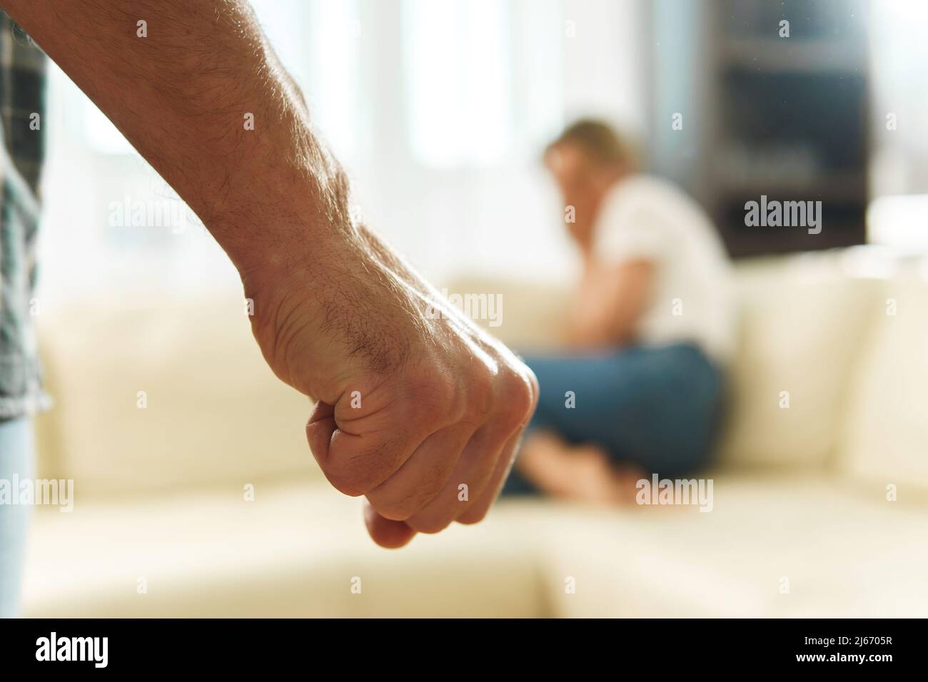 Scared woman victim of domestic violence attacked by her partner Stock ...