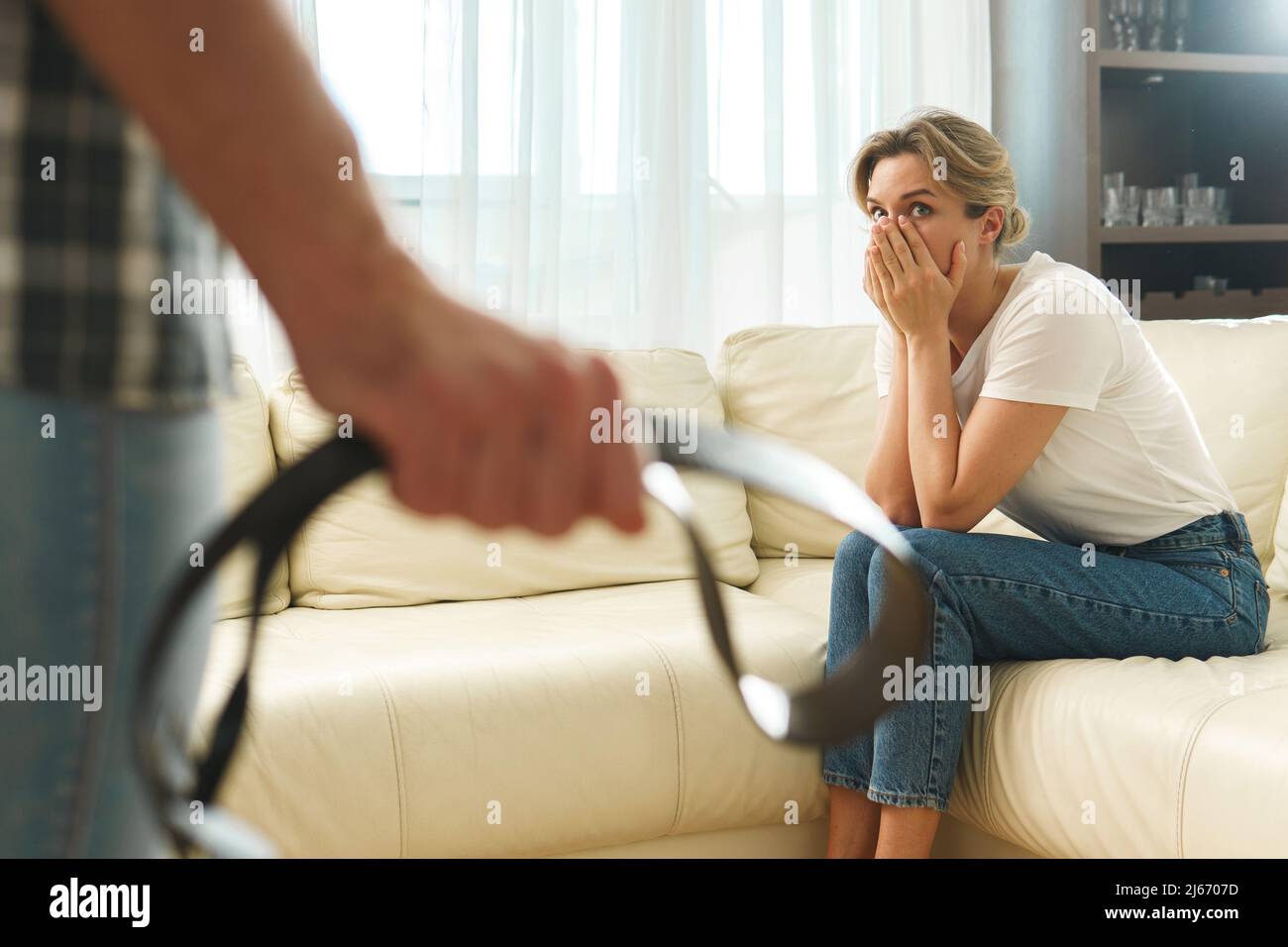 Scared woman victim of domestic violence attacked by her partner Stock ...