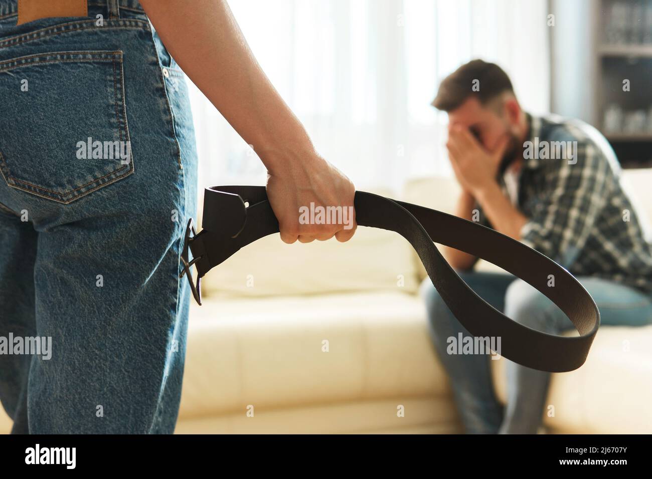 Sad man victim of domestic violence attacked by his aggressive partner ...