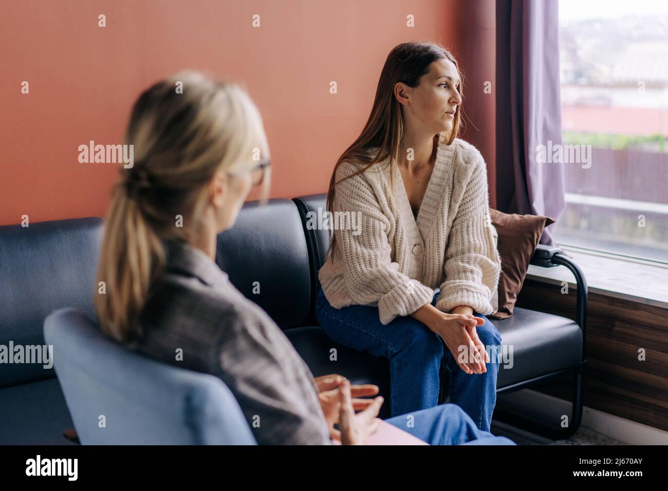 Sad Frustrated Woman Talking In A Session With A Psychotherapist About