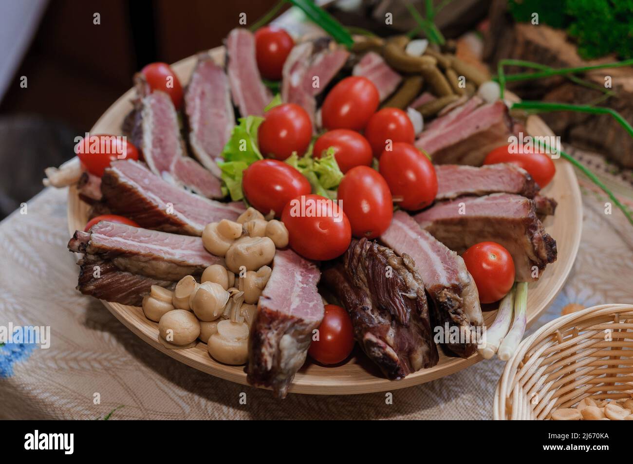Slicing different types of meat. Meat snacks on the table. wedding ...