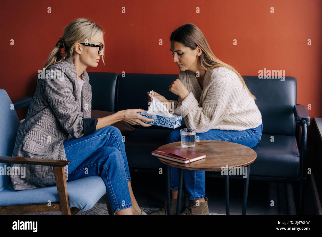 Millennial European woman in depression at the reception of a ...