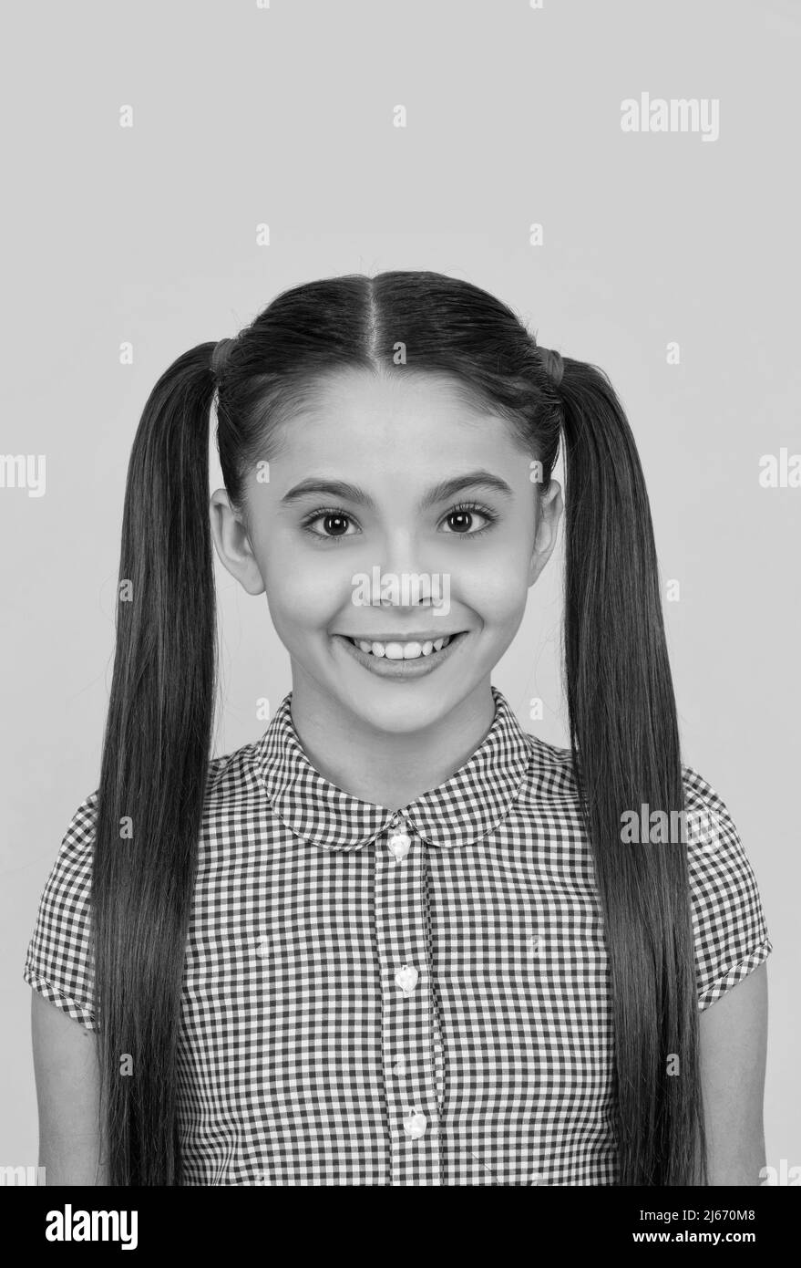 Smile lit up her face. Smiling child face. Happy girl portrait yellow ...