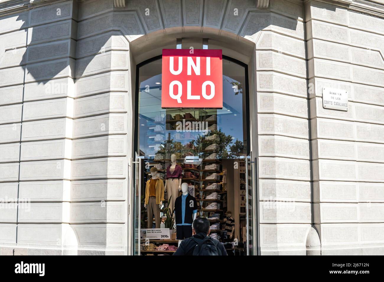 Japanese clothing brand Uniqlo logo and store in Barcelona, Spain Stock ...
