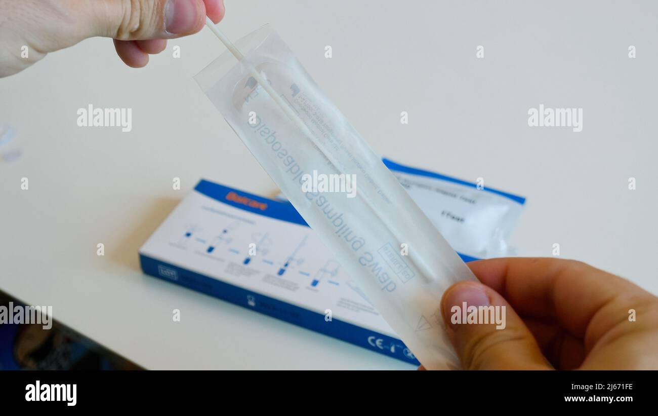Man hands unpacking sterile nasal swab for antigen rapid test on Covid ...