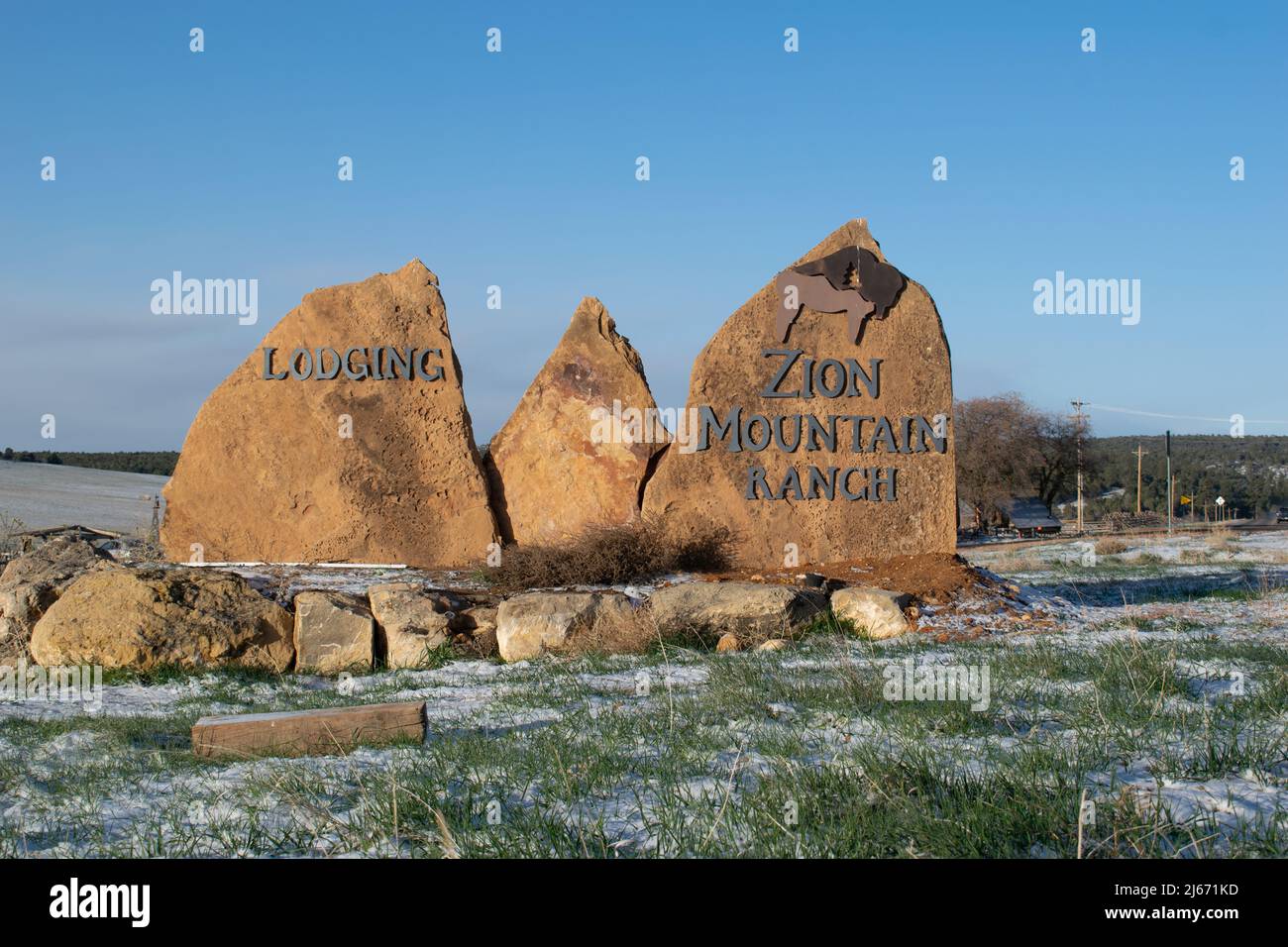 Entrance to Zion Mountain Ranch with sign of The Three Patriarchs peaks ...