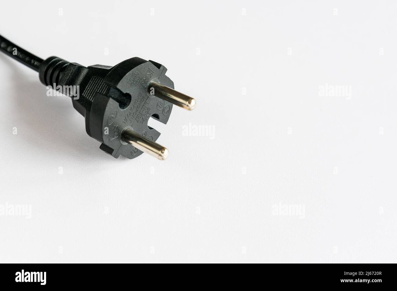 Black plug on white background,cost of electricity and expensive energy ...