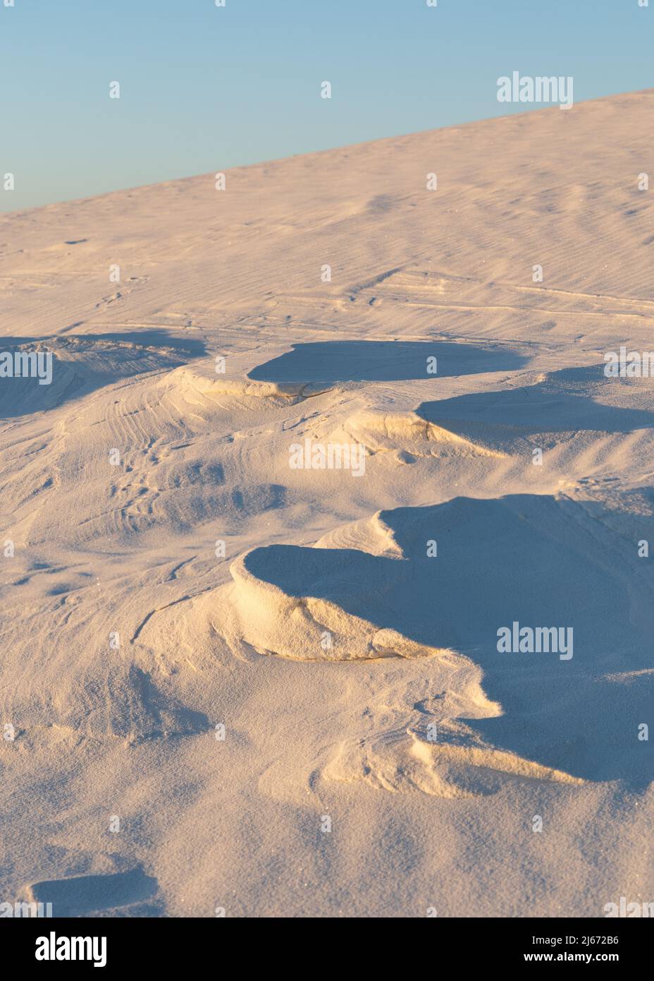 Patterns in hardened sand breaking through the gypsum sand dunes in ...