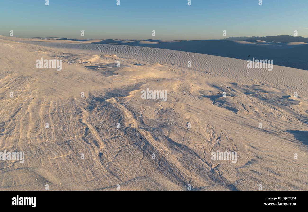Patterns in hardened sand breaking through the gypsum sand dunes in ...