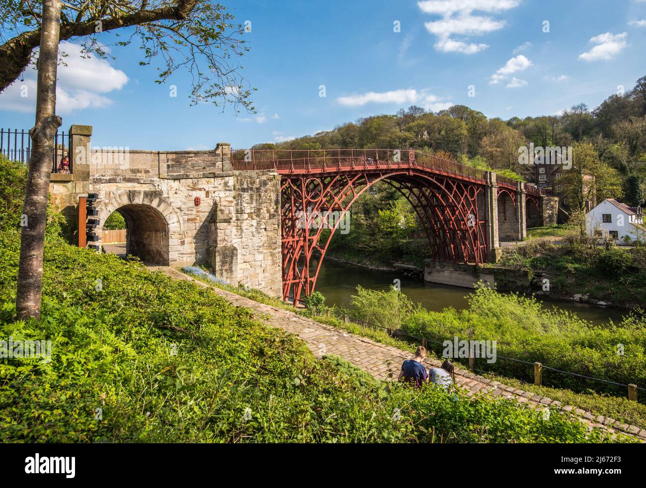 The famous cast iron arch bridge across the River Severn at Ironbridge ...