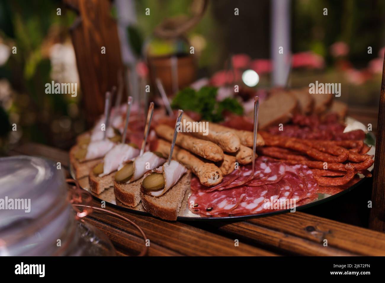 Slicing different varieties of meat. Wedding buffet Stock Photo - Alamy