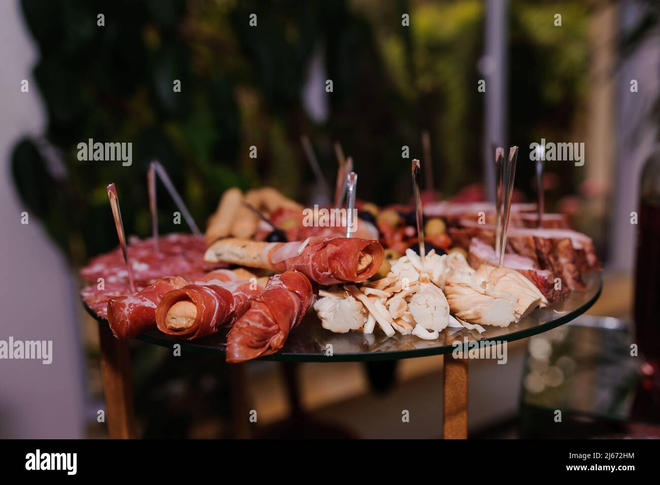 Slicing different varieties of meat. Wedding buffet Stock Photo - Alamy