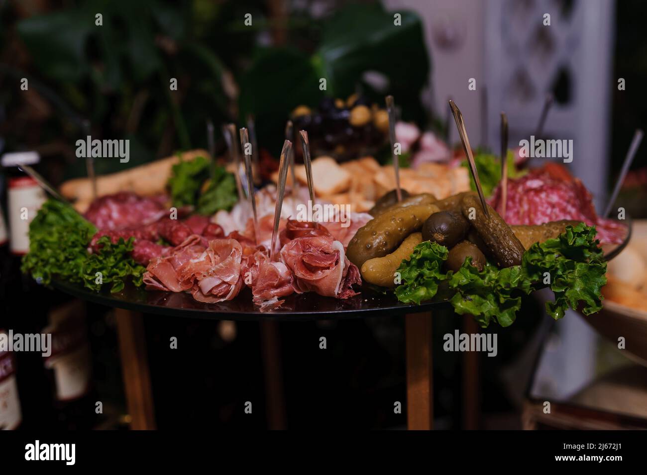 Slicing different varieties of meat. Wedding buffet Stock Photo - Alamy