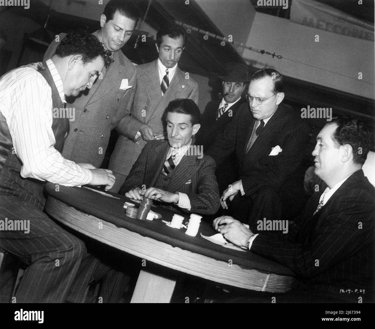 DAMON RUNYON (2nd from right) on set candid during filming of BUTCH ...