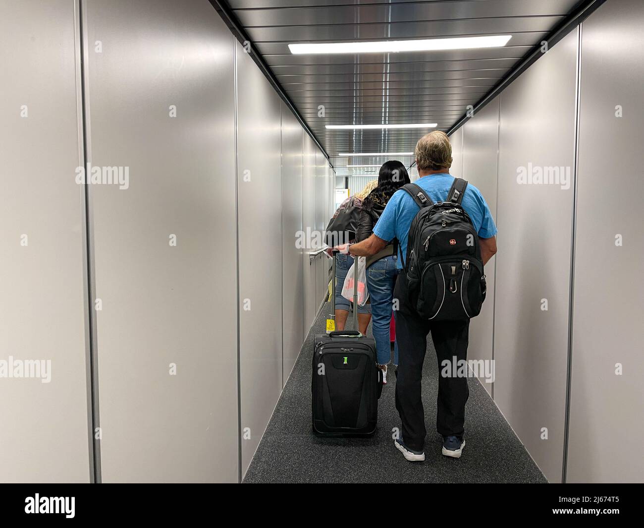 Orlando, FL USA - September 23, 2021: A man walking in the jetway to ...