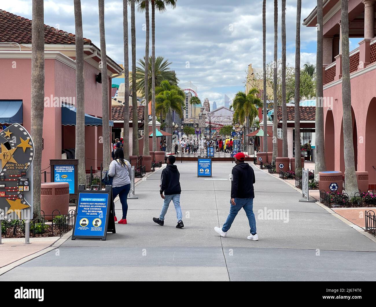 Orlando FL USA April 3 2021 People Walking Around Universal Studios Resort Theme Park Stock orlando-fl-usa-april-3-2021-people-walking-around-universal-studios-resort-theme-park-stock