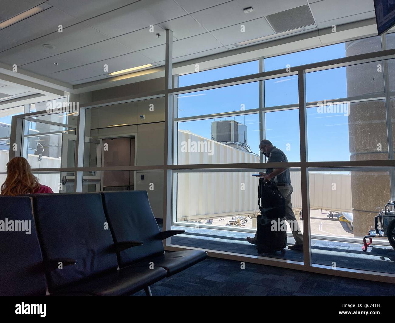 Orlando, FL USA - September 23, 2021: A man walking in the jetway to ...