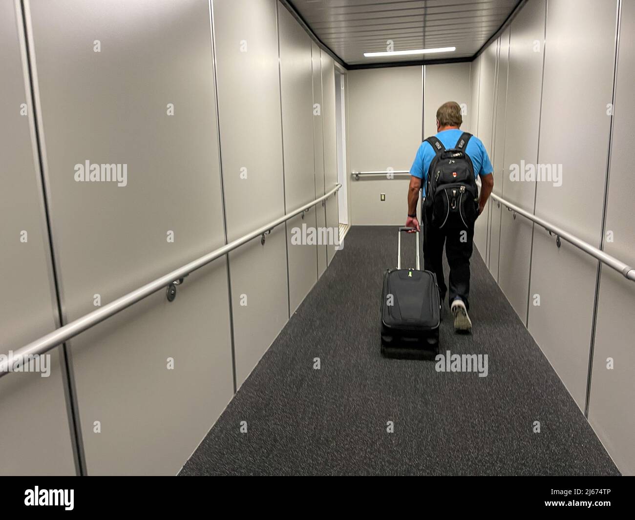 Orlando, FL USA - September 23, 2021: A man walking in the jetway to ...