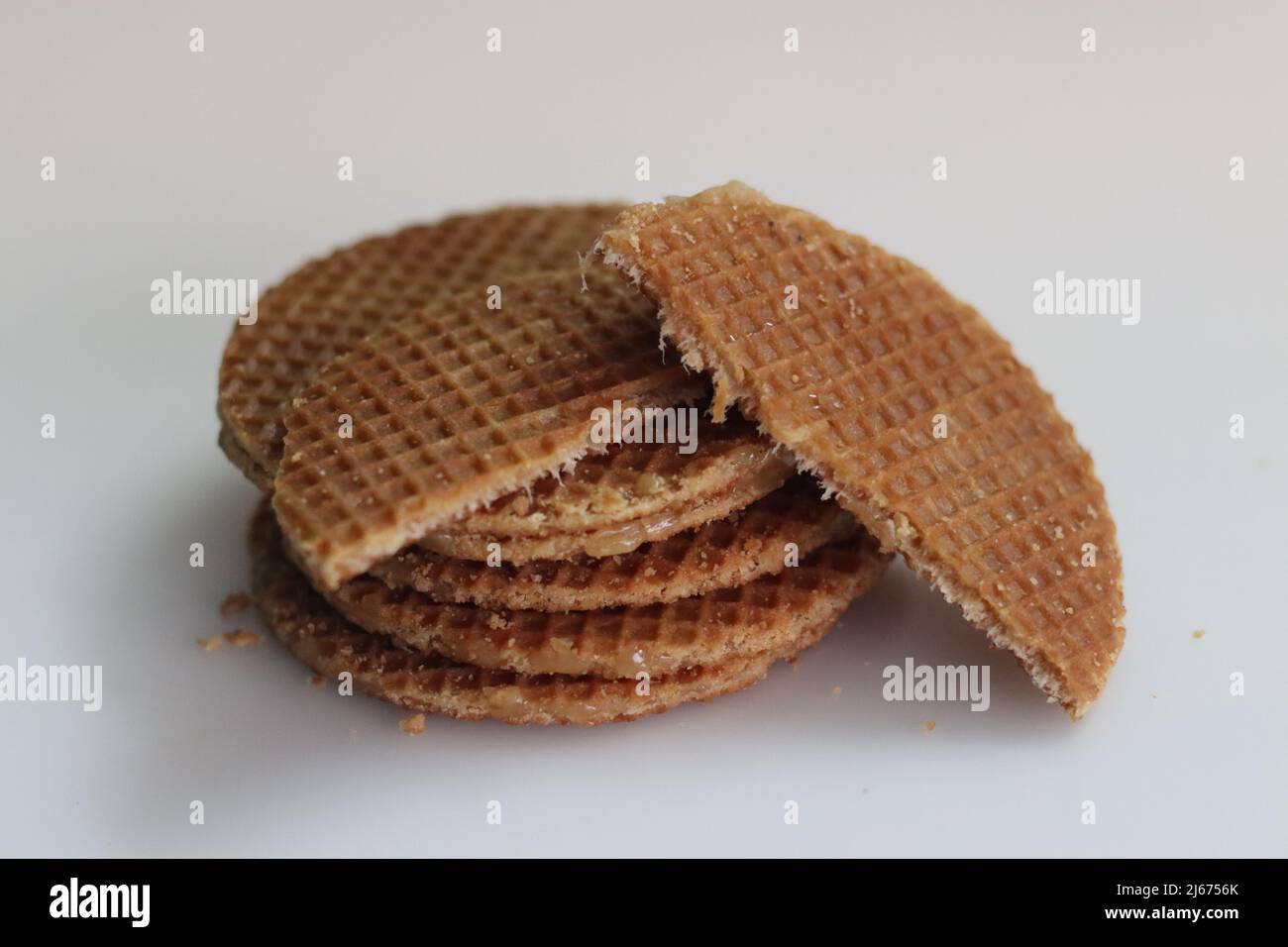 Stoopwafles. A stack of popular jumbo syrup waffels with honey. Shot on ...