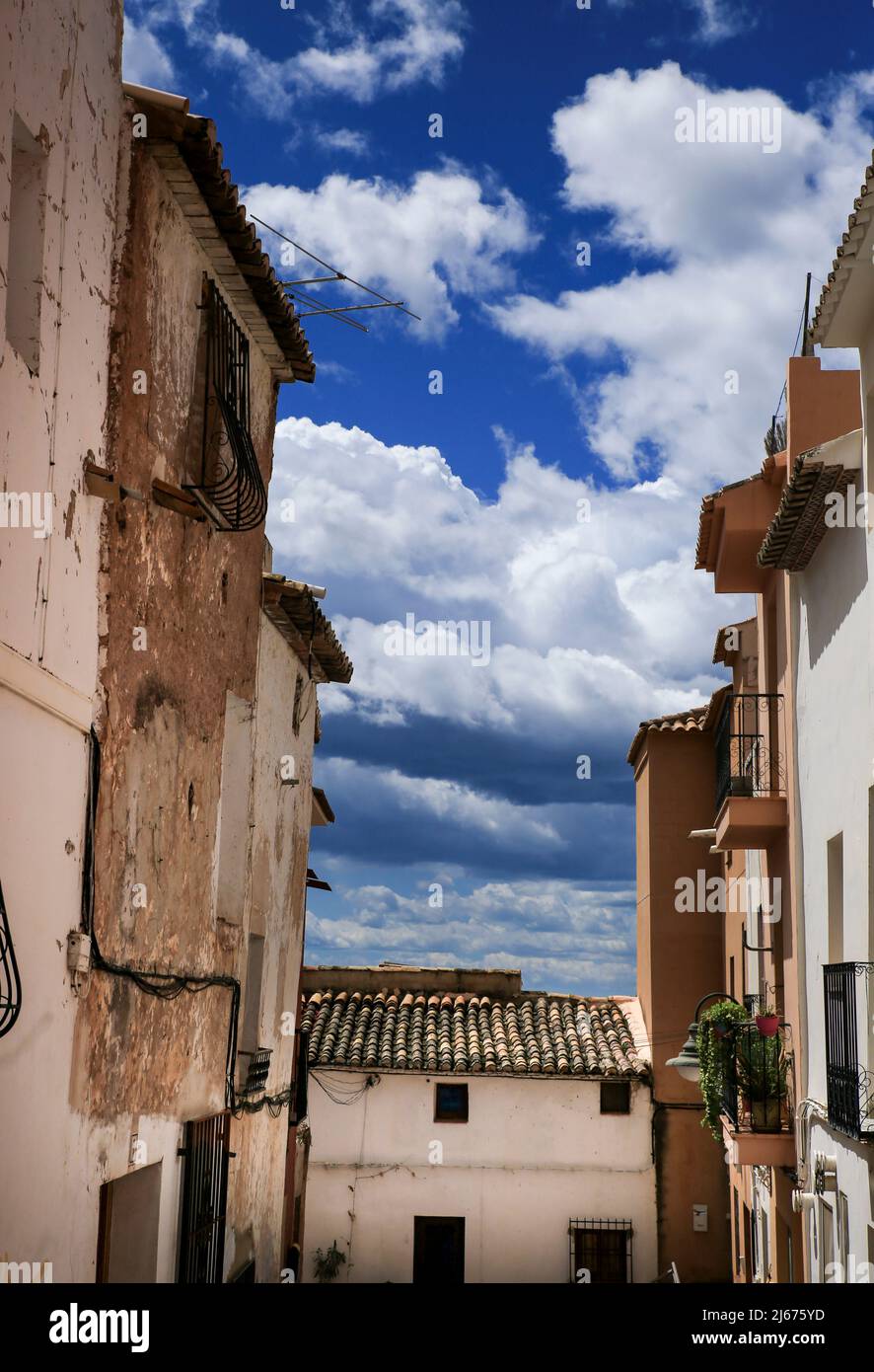 Old colorful facades under beautiful sky in Finestrat village, Alicante ...